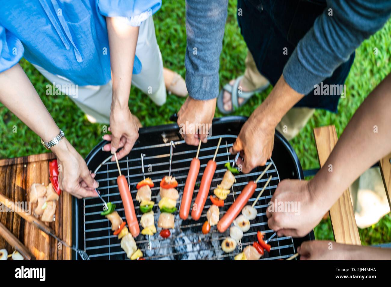 People hand grill BBQ in food party home garden happy friendship Stock ...