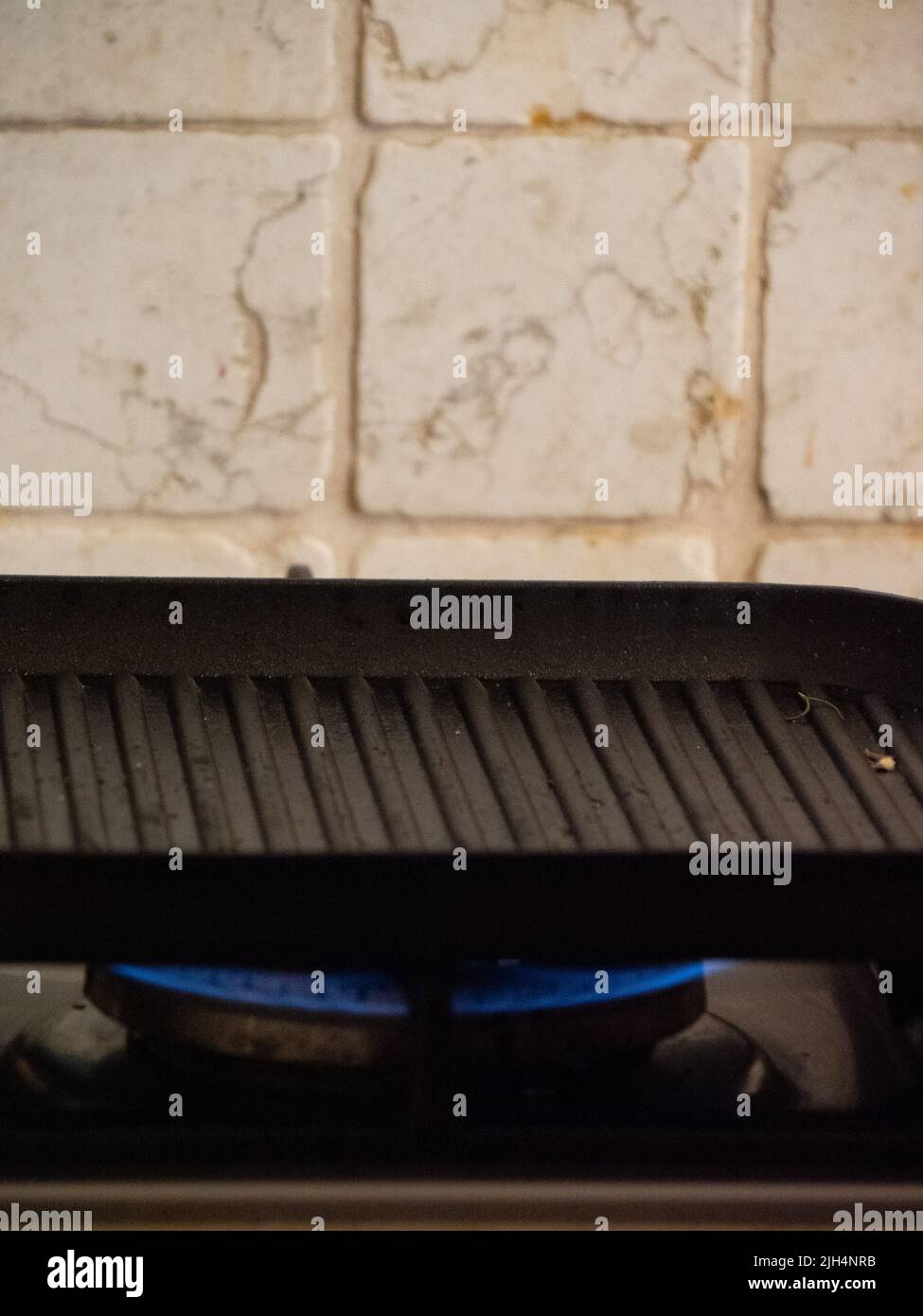preparing a grill for cooking with heat and olive oil Stock Photo - Alamy