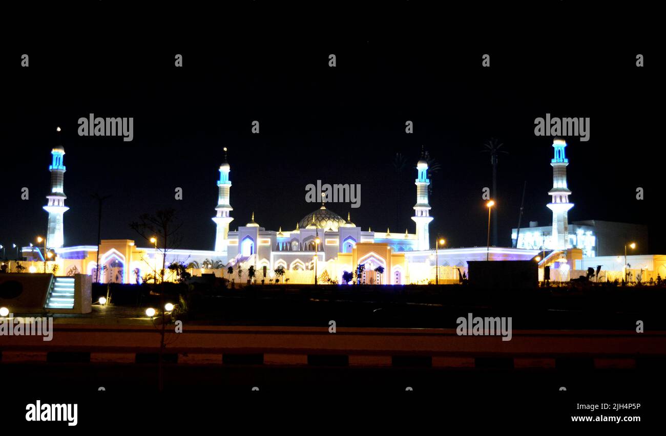 Night scene of a grand mosque in Cairo Egypt with multiple domes and ...