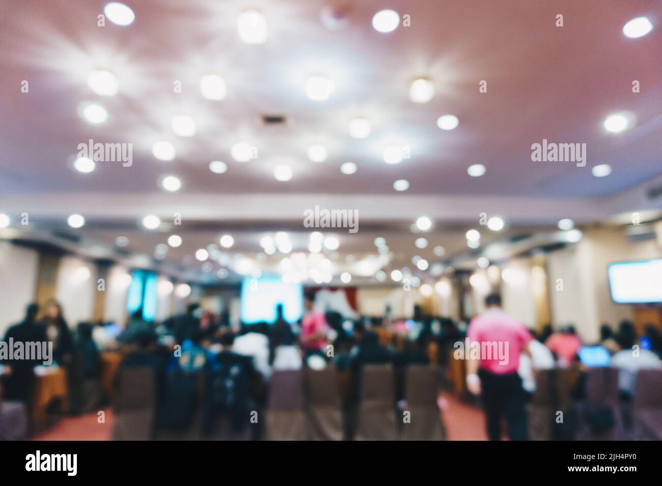 Blurred background group of people in seminar conference hotel room ...