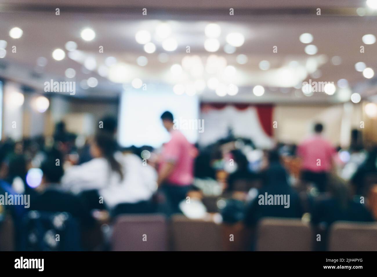 Blurred background group of people in seminar conference hotel room ...