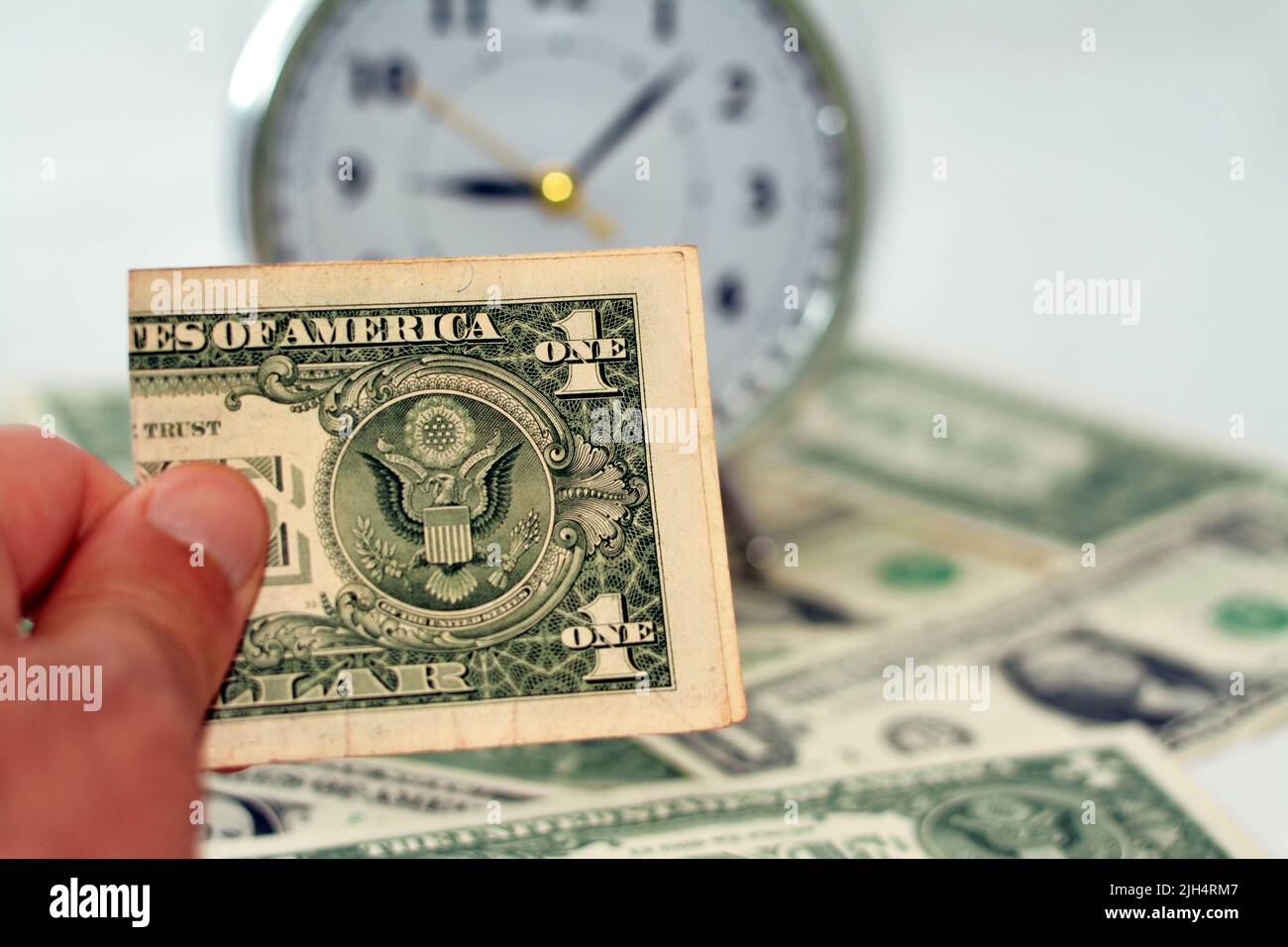 A hand holding American money banknote currency bills, USA dollars with ...
