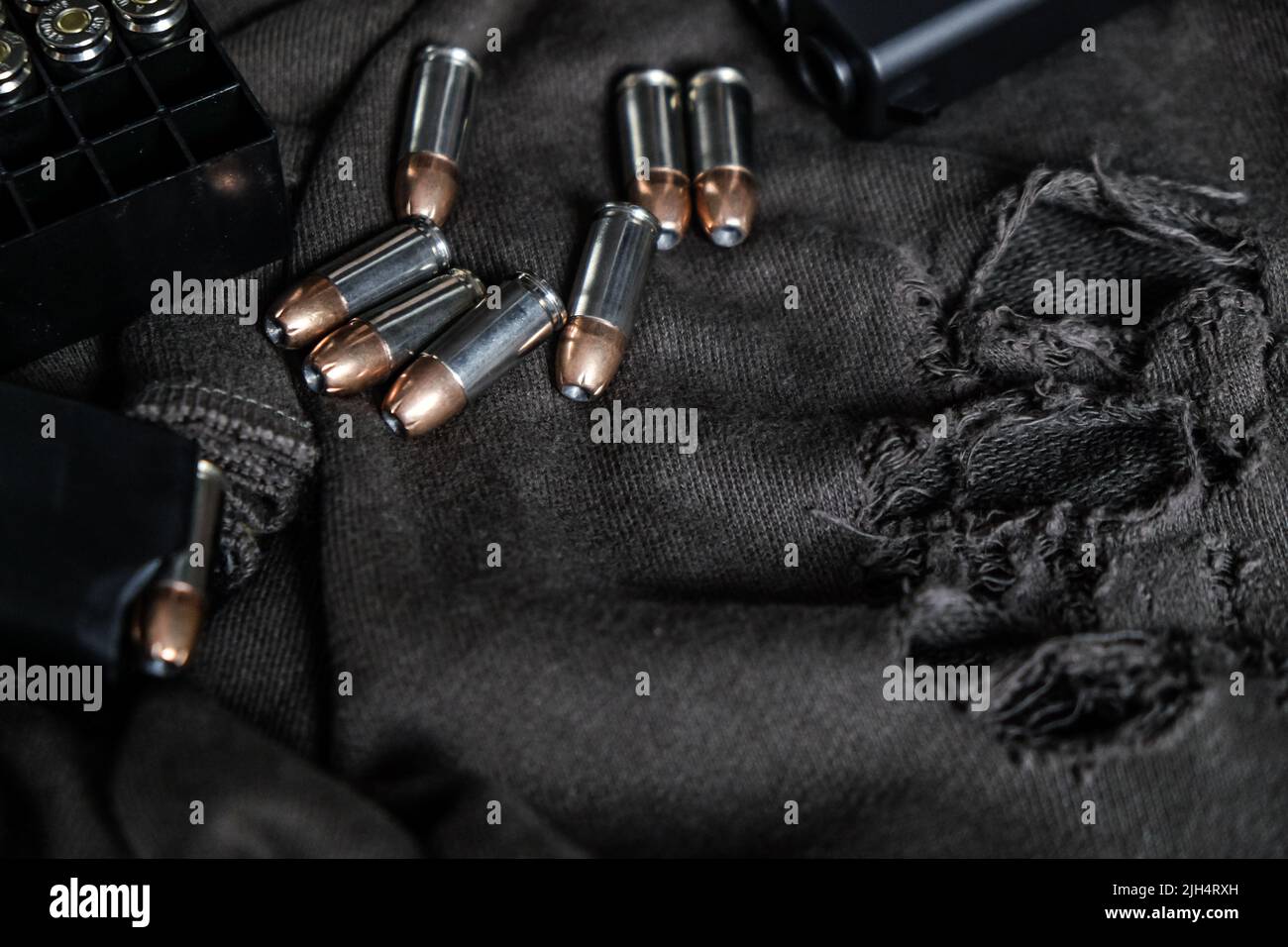 9mm conceal semi automatic gun with jacket hallow point bullet on cloth ...
