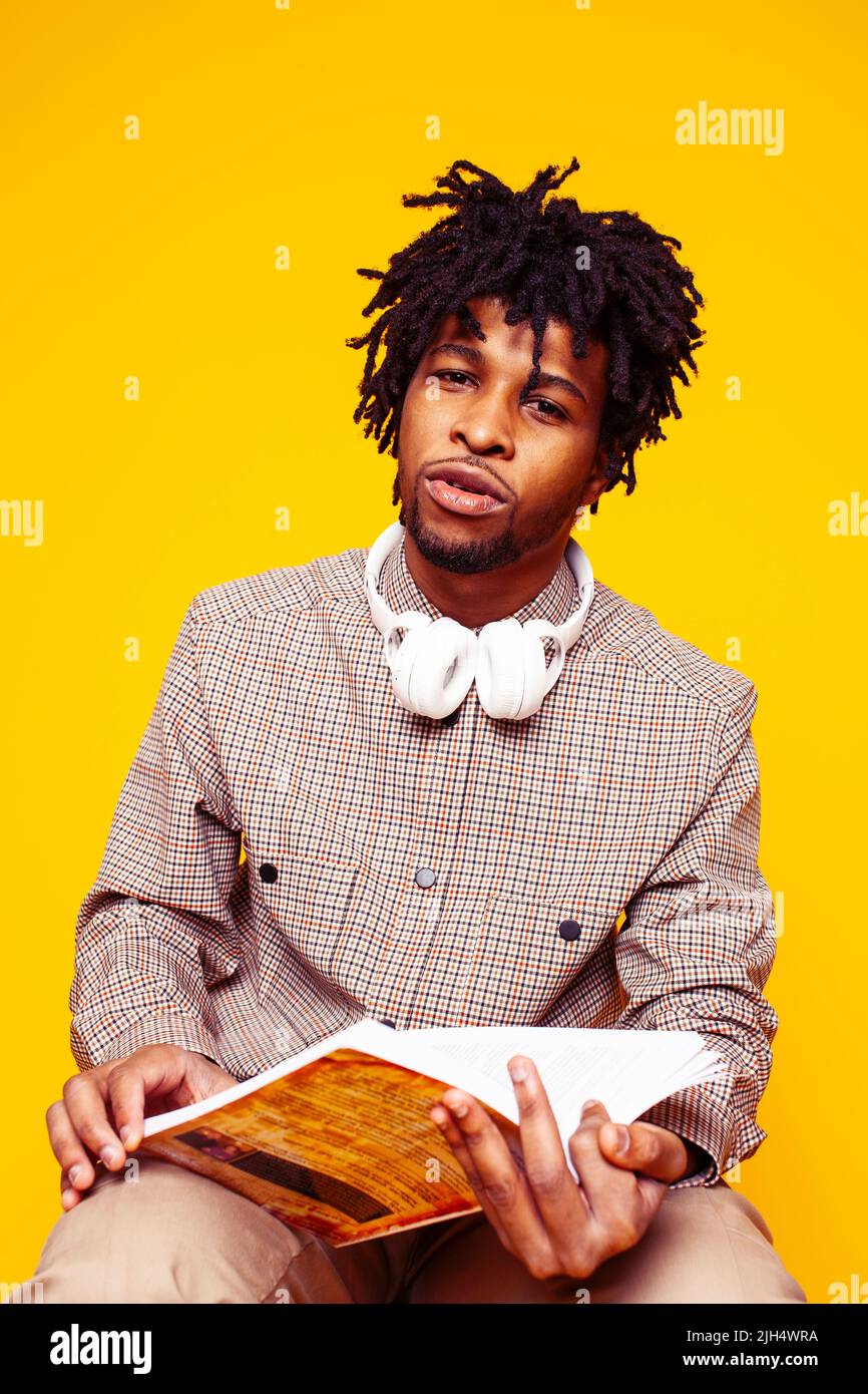 Young handsome african american guy student posing cheerful and ...