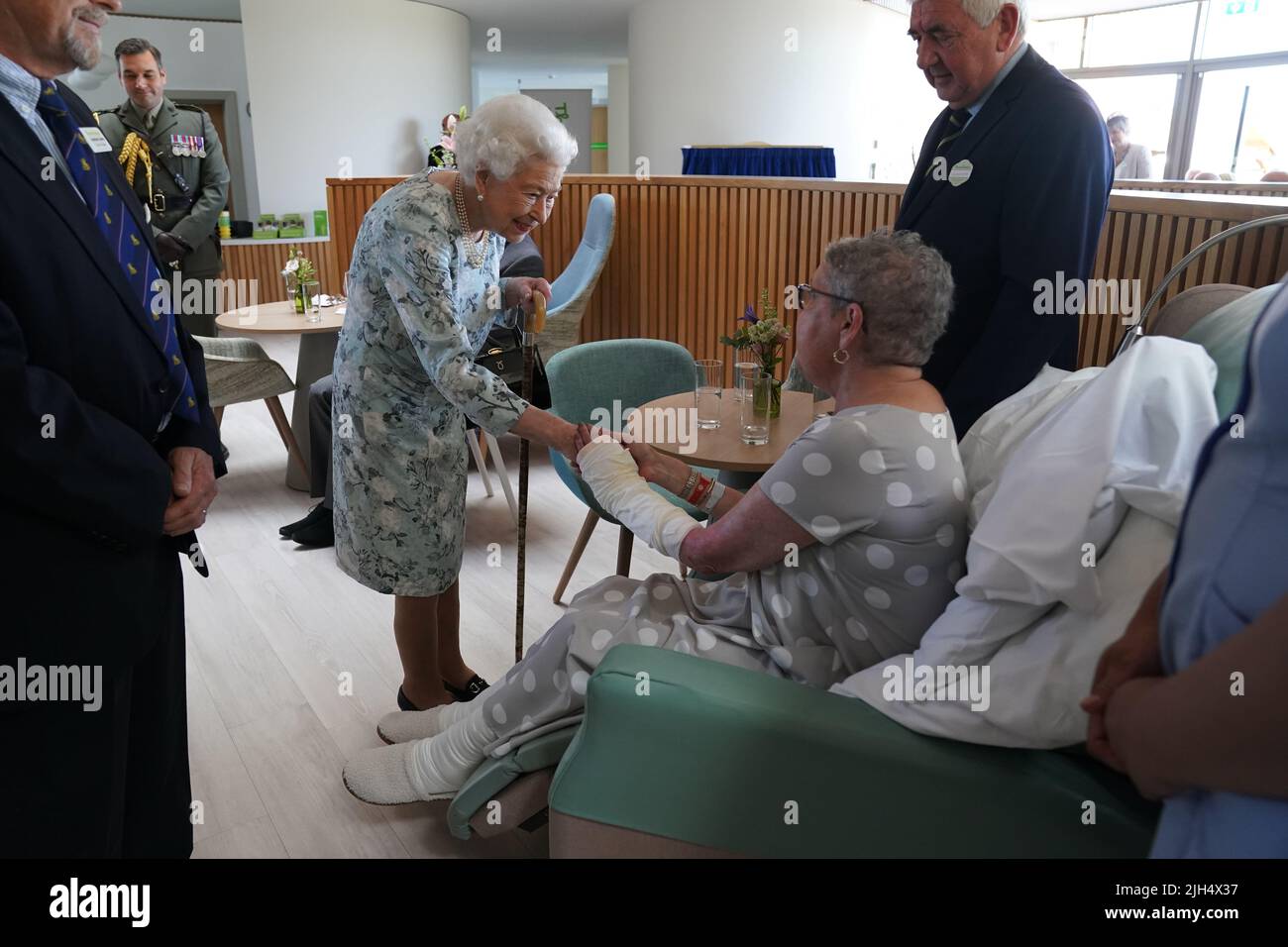 Queen Elizabeth II meeting patient Pat White during a visit to ...