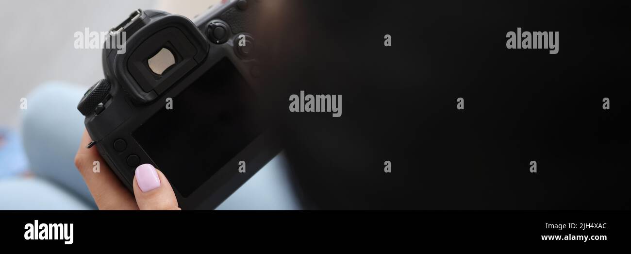 Woman hold turned off camera, black screen, not work after damage Stock ...