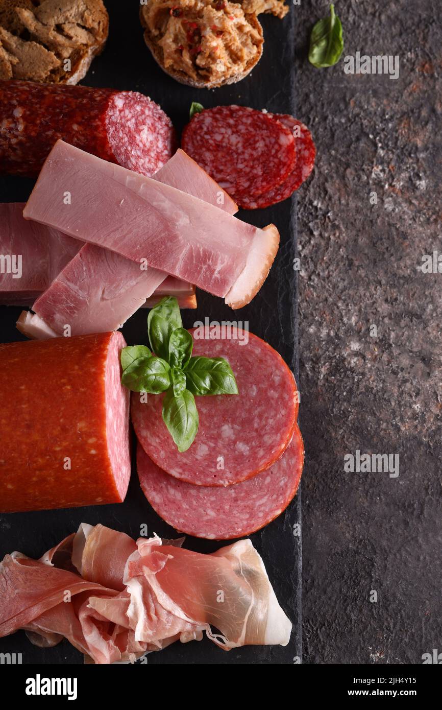delicacy food smoked sausages and ham Stock Photo - Alamy