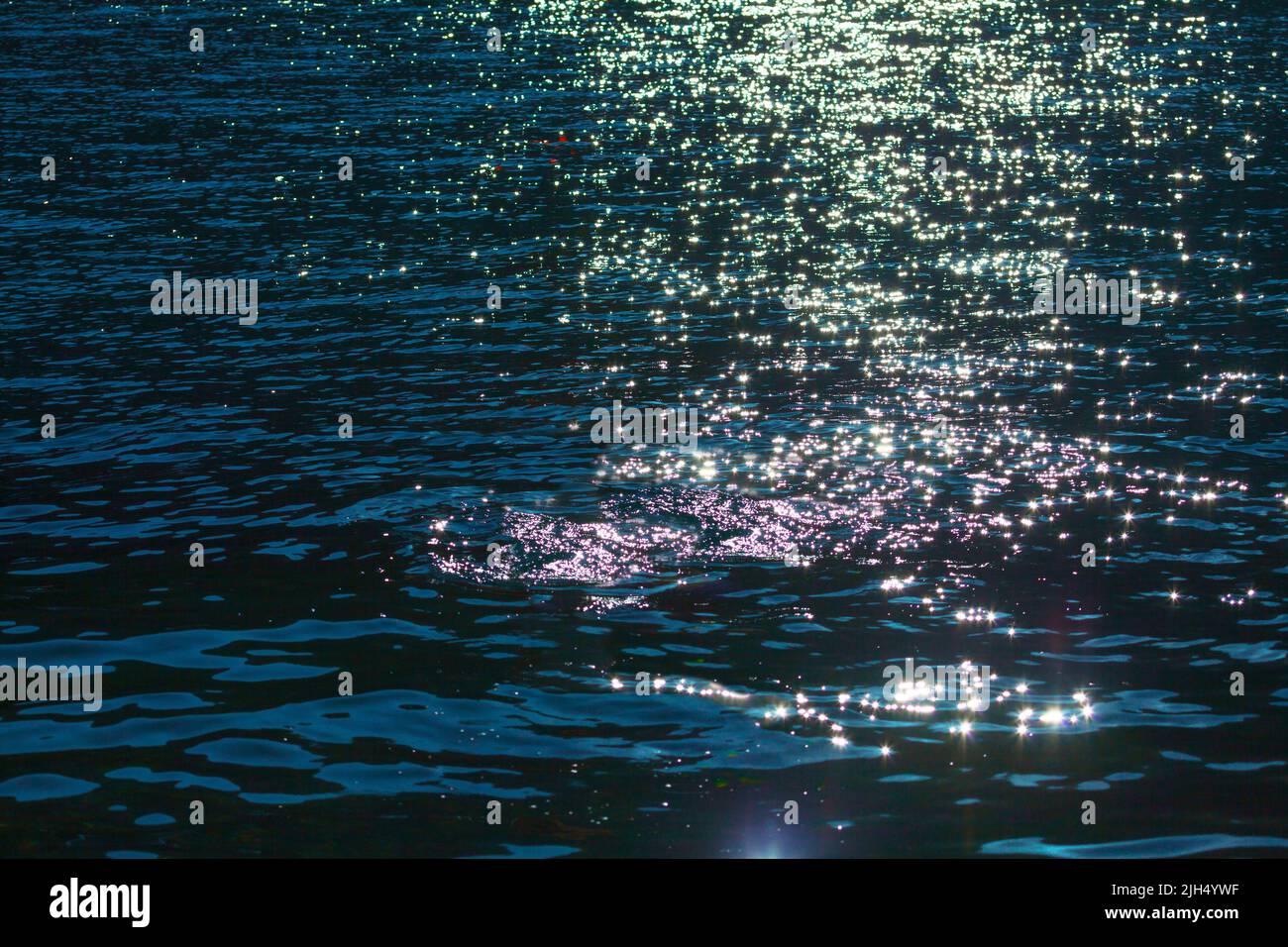 Stars reflection in the sea . Glowing at water surface Stock Photo - Alamy