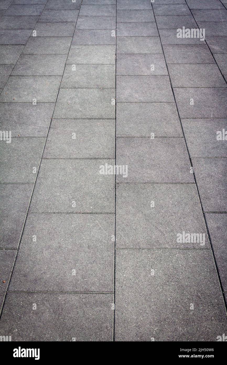 Old concrete tiles in the walkway. Abstract architecture background ...