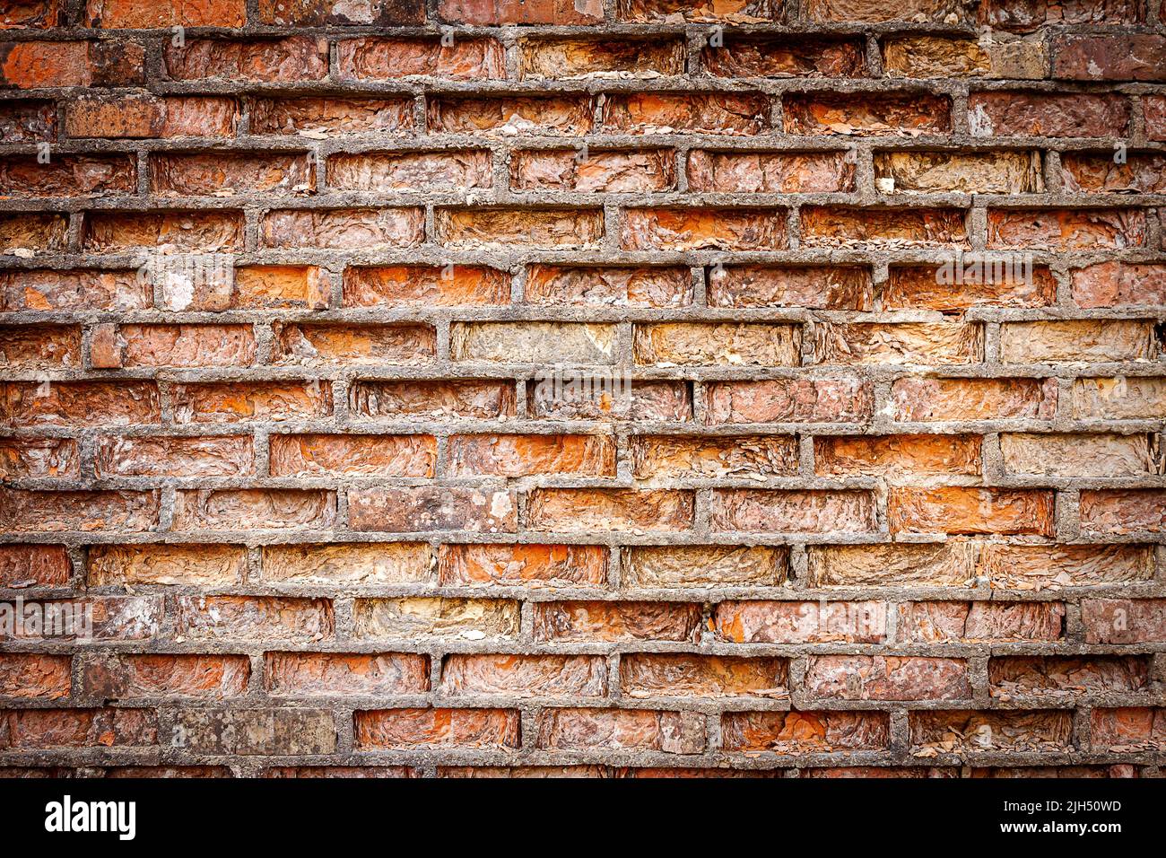 Background of yellow and red brick wall texture Stock Photo - Alamy