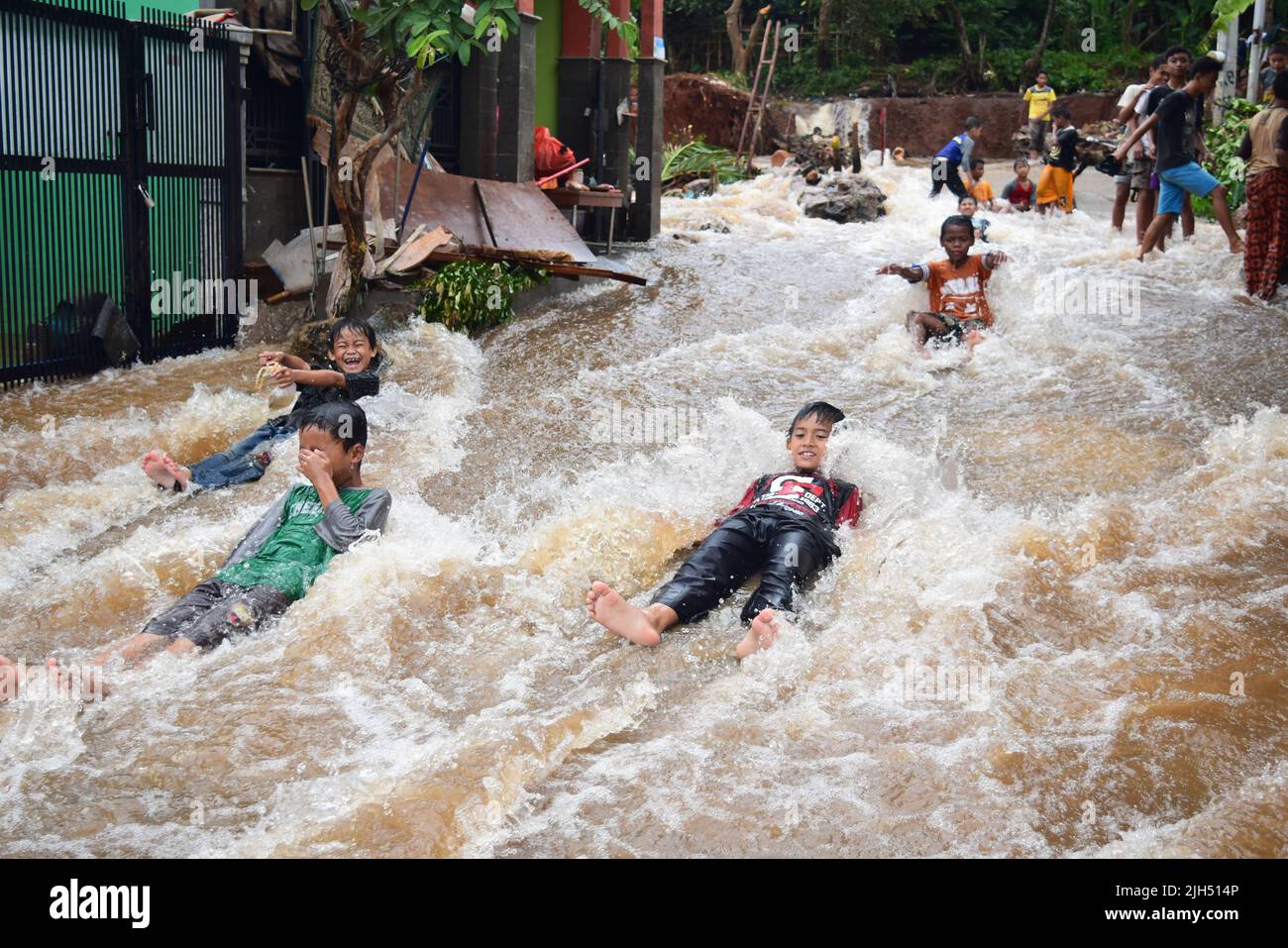 Children playing in flood water hi-res stock photography and images - Alamy