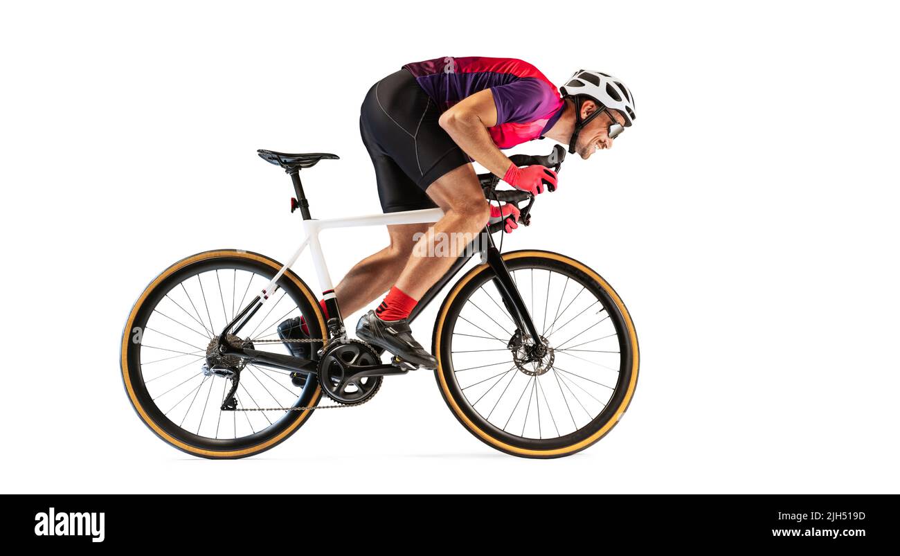 Portrait of man, professional cyclist training, riding isolated over ...