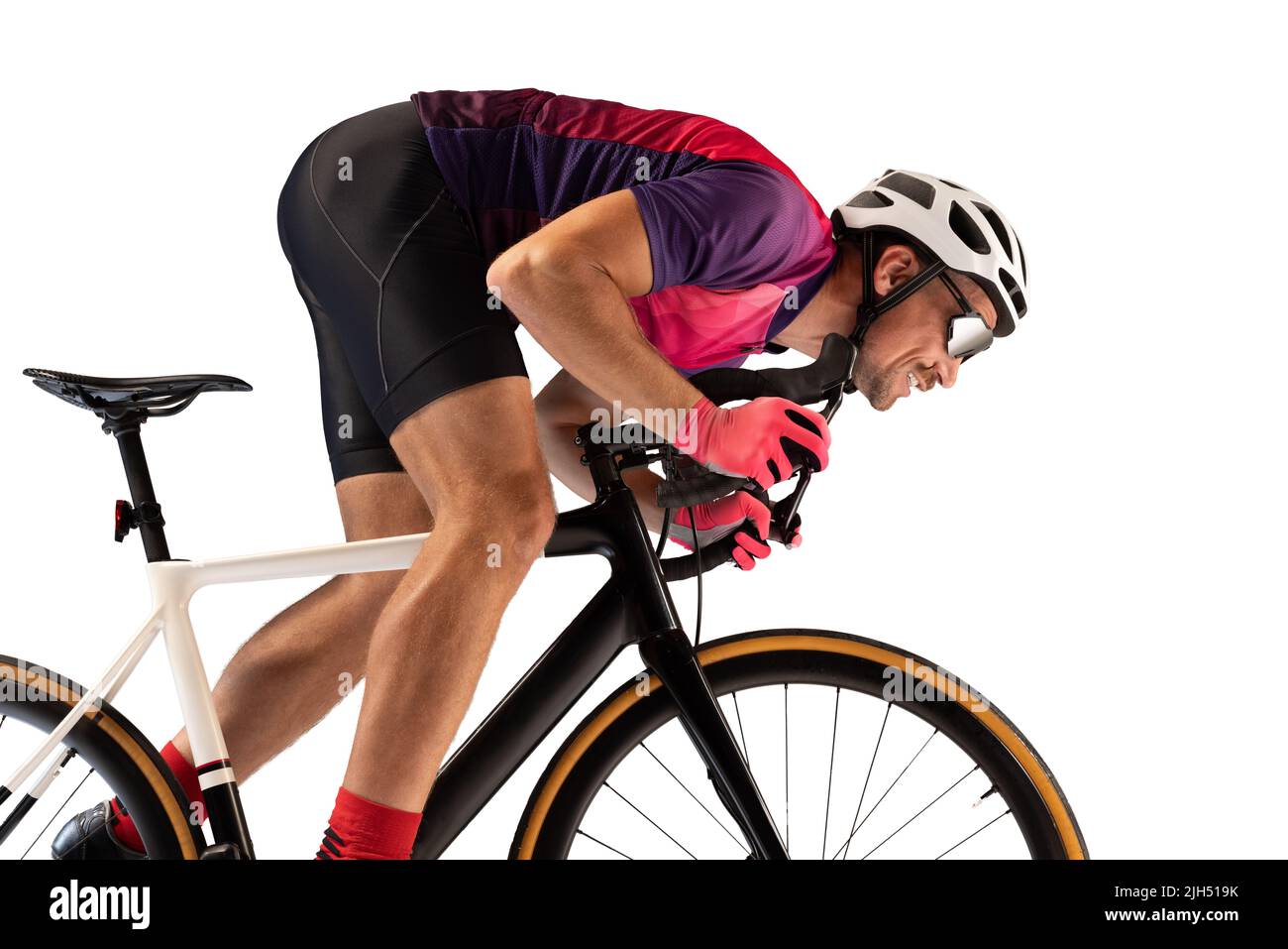 Portrait of man, professional cyclist training, riding isolated over ...