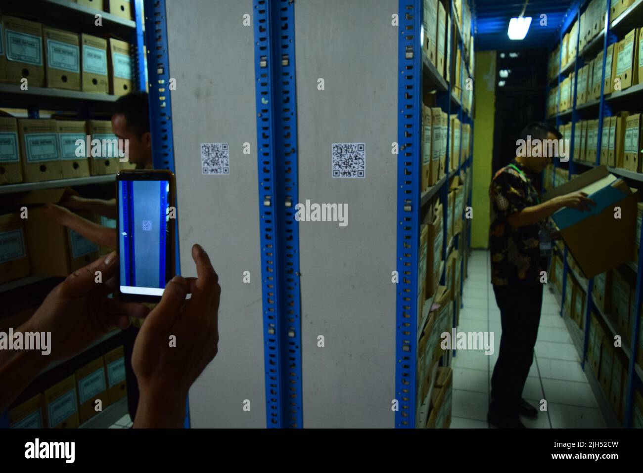 Bogor, Indonesia - 2020 : officers check the digital archives of the ...