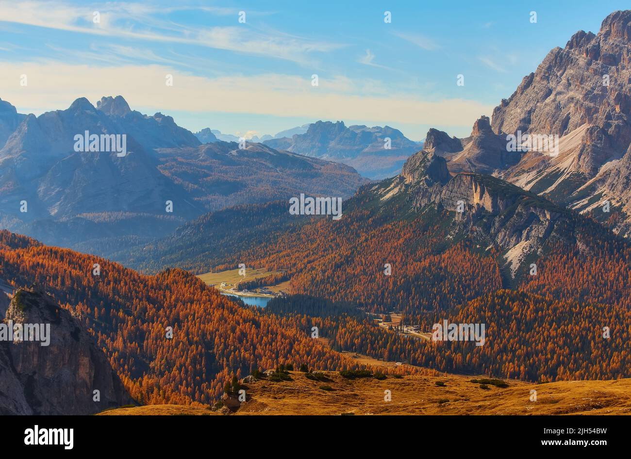 Stunning alpine Landscape at sautumn sunny day. Alpine meadow and road ...
