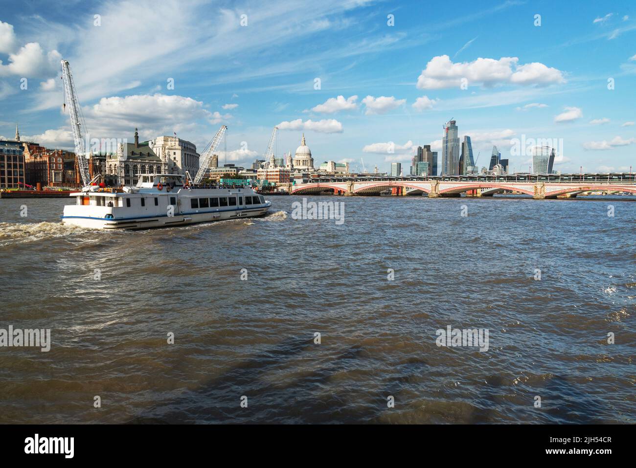 Tourism boat carrying visitors to the city of London to see iconic ...