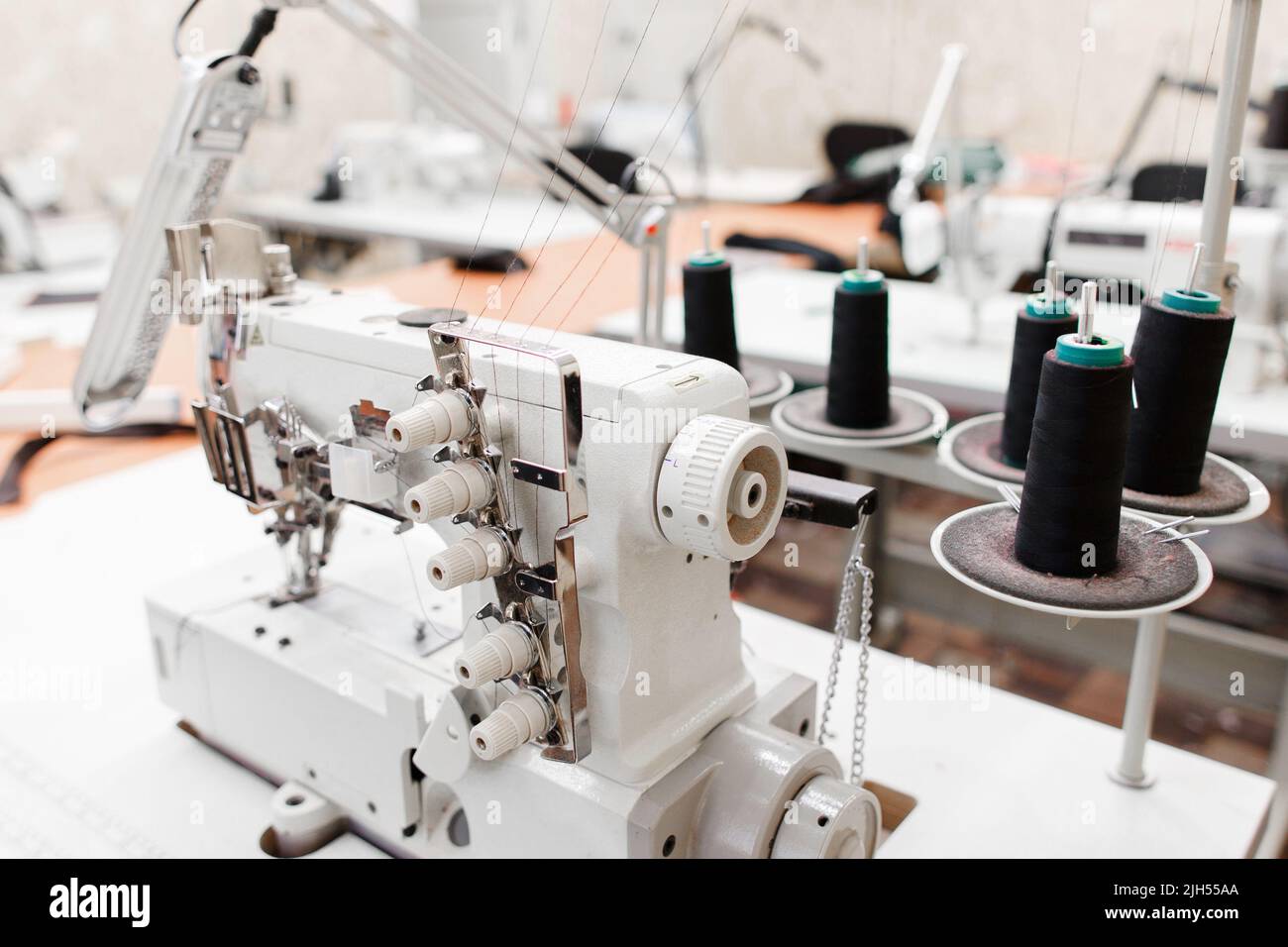 Professional overlock sewing machine in workshop Stock Photo - Alamy