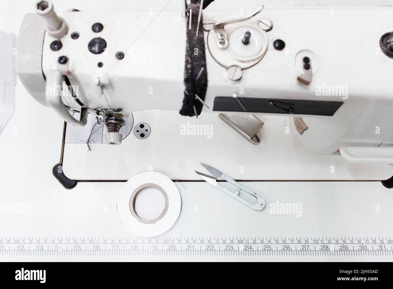 Sewing machine with tools top view, free space Stock Photo - Alamy