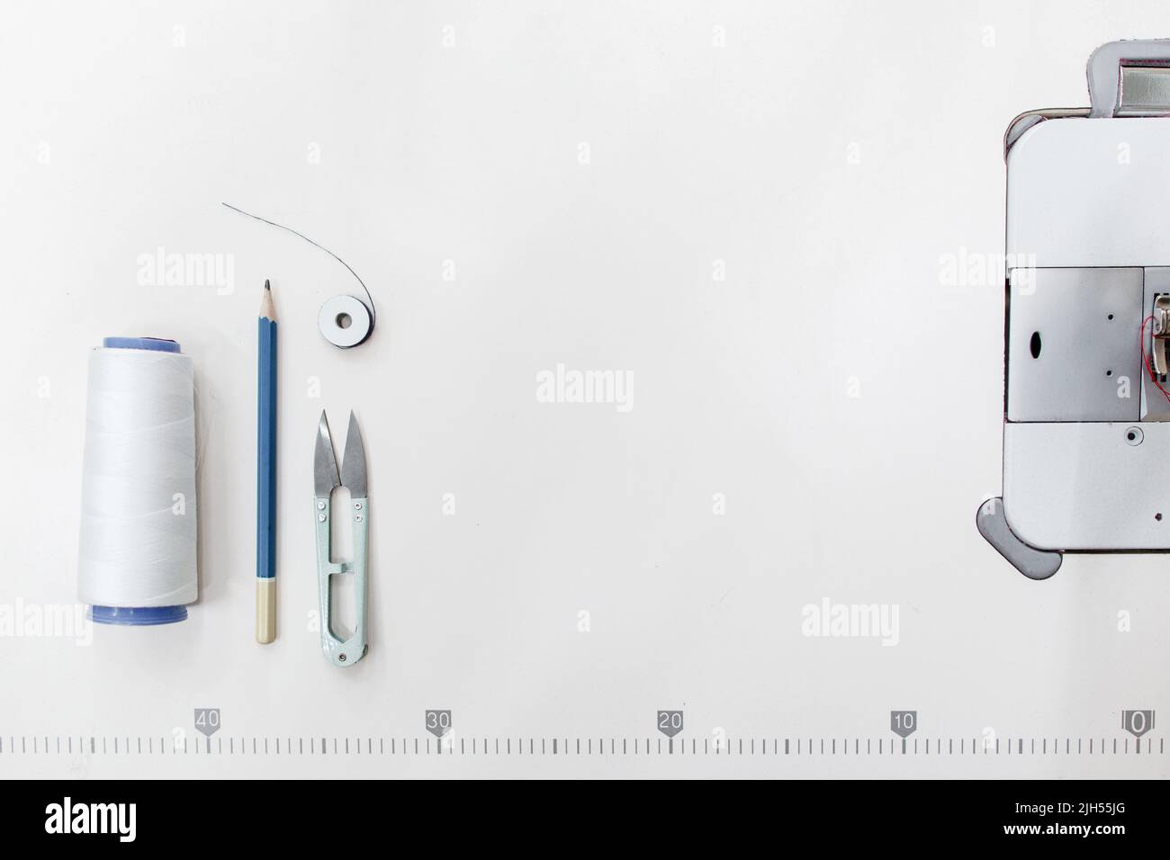 Tailor supplies frame, free space on white Stock Photo - Alamy