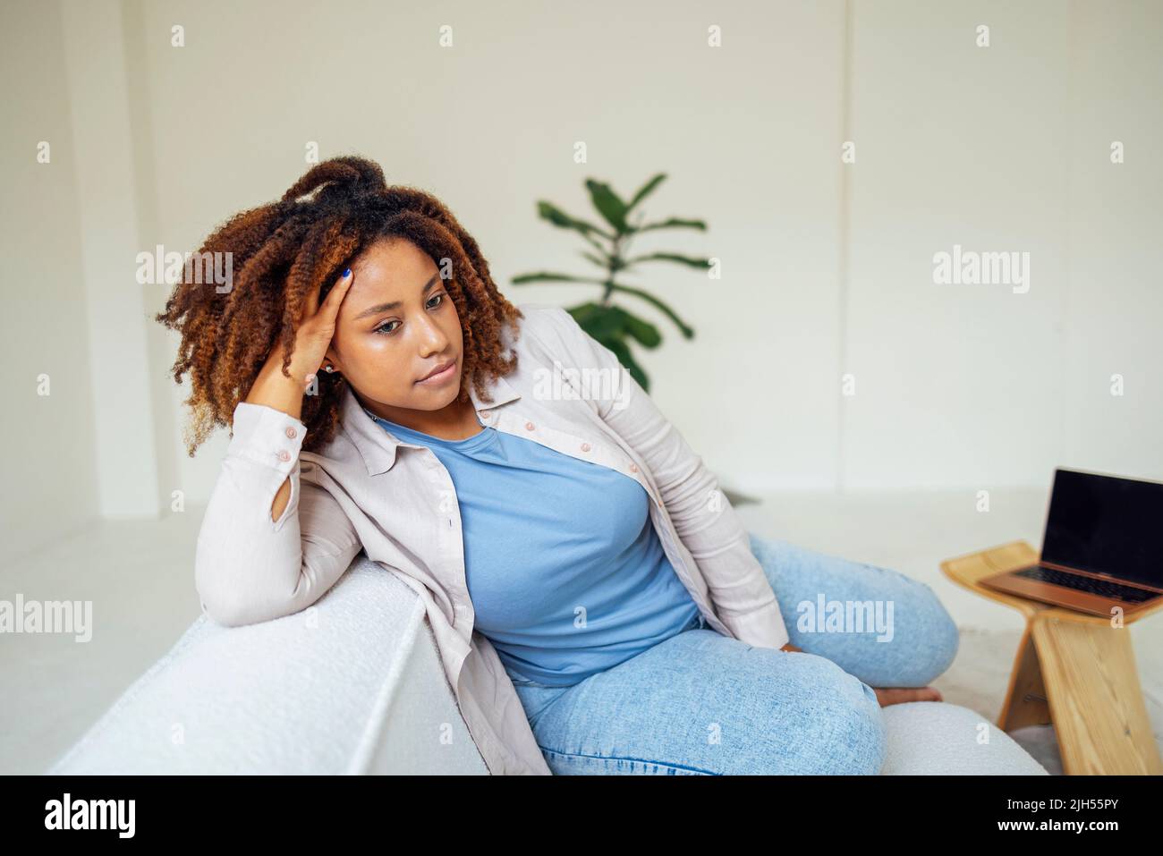 Sad young african american woman, reading email with amazing ...