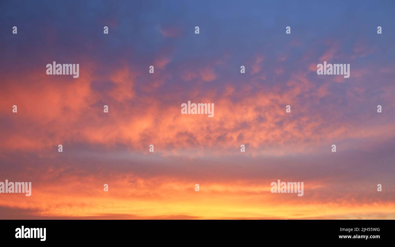 Cloudscape of cumulus sunset clouds with sunlight Stock Photo - Alamy
