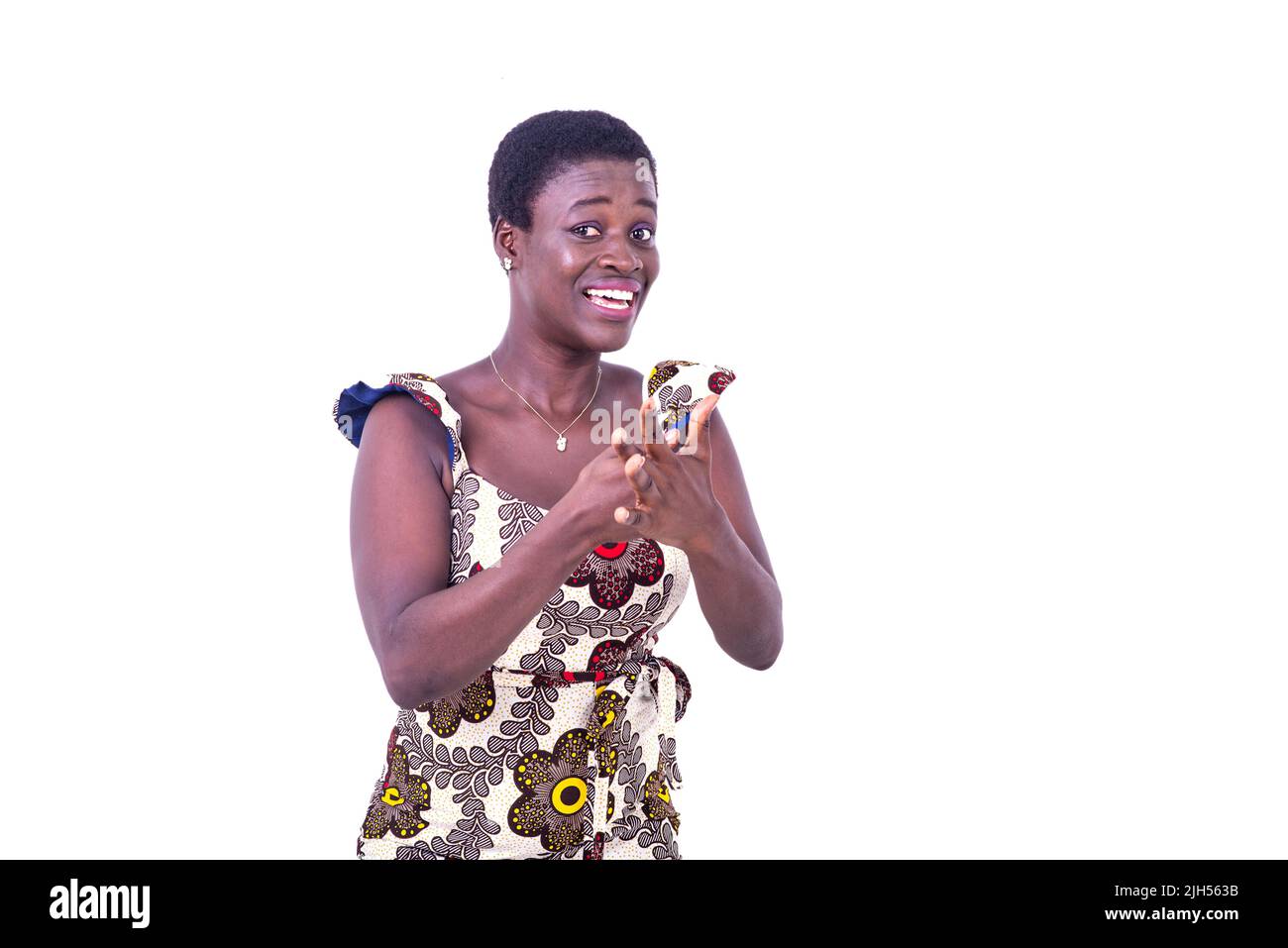 portrait of a beautiful furious young woman standing and clapping her ...