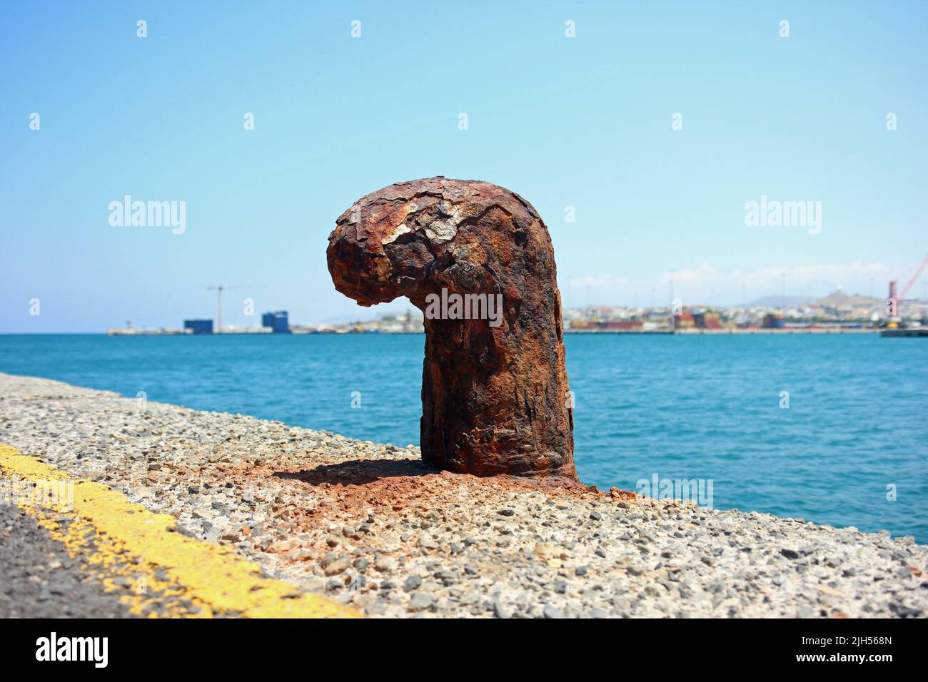 Rusty capstan in harbor Stock Photo - Alamy