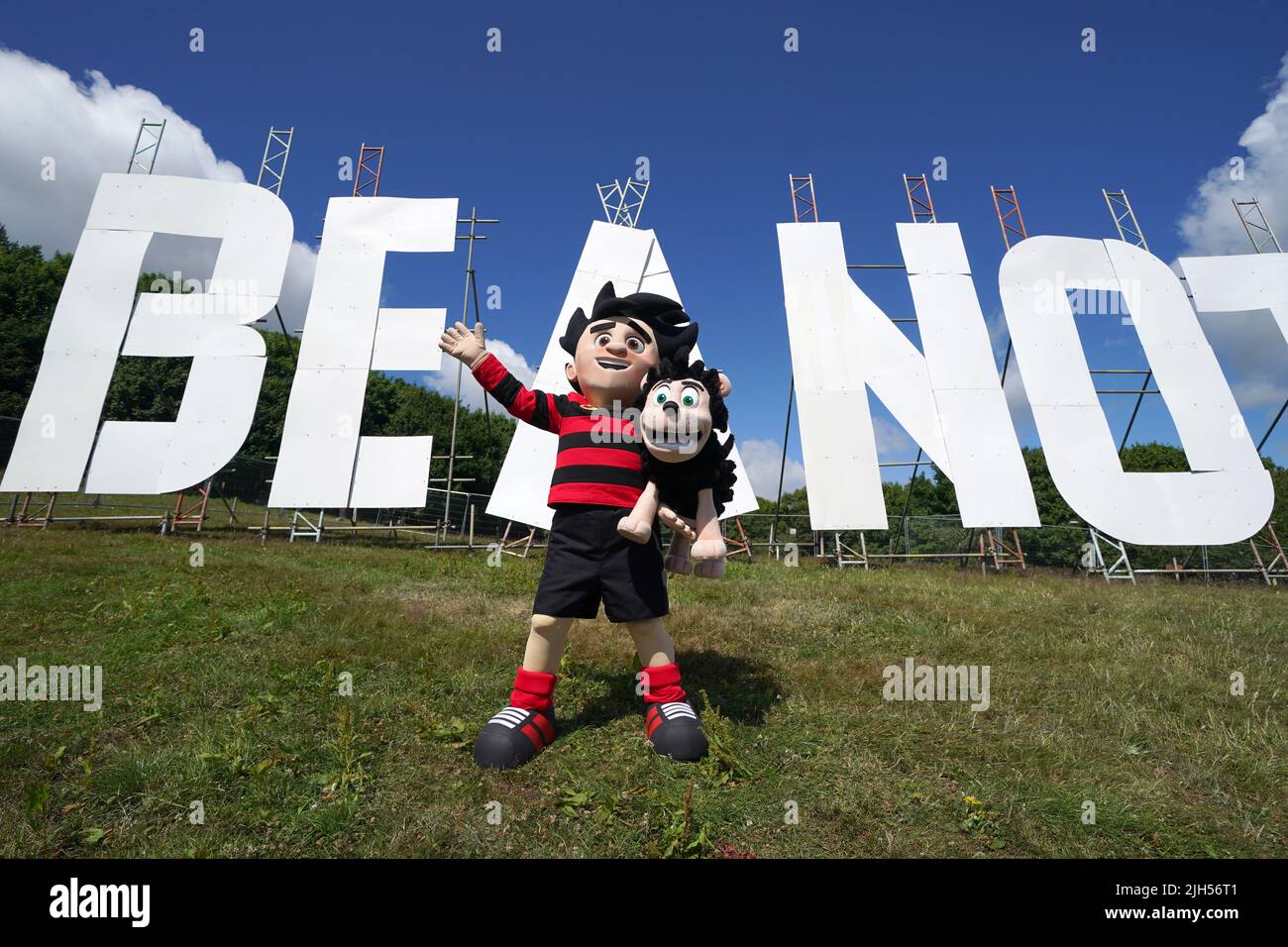 Dennis the Menace stands in front of a giant sign erected at Dundee Law ...