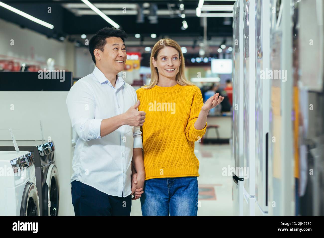 happy asian couple family man and woman make a choice choose of new ...