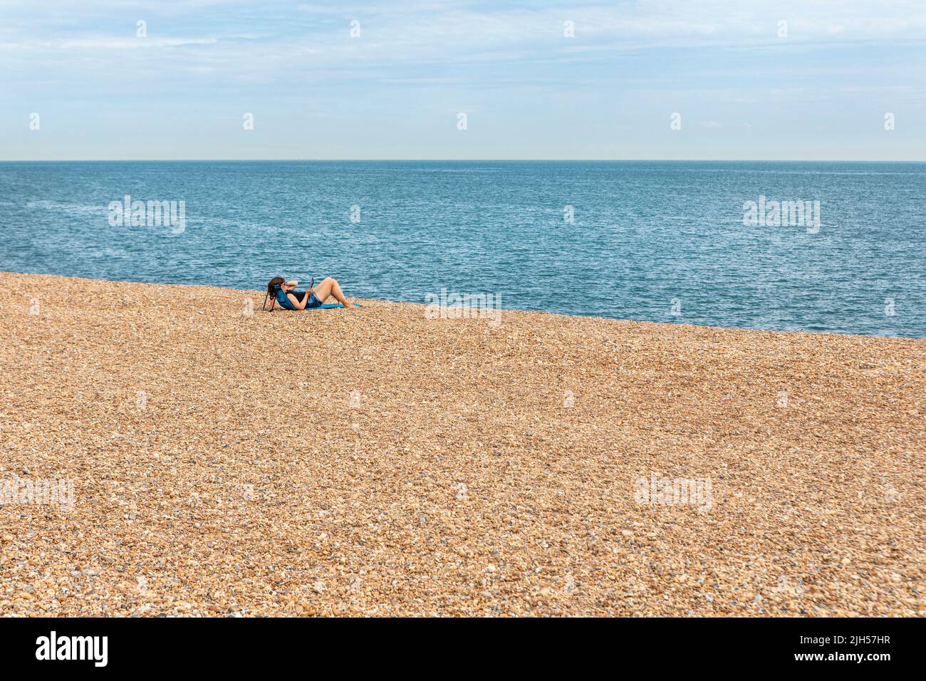 Beach seaside solitary reading alone hi-res stock photography and ...