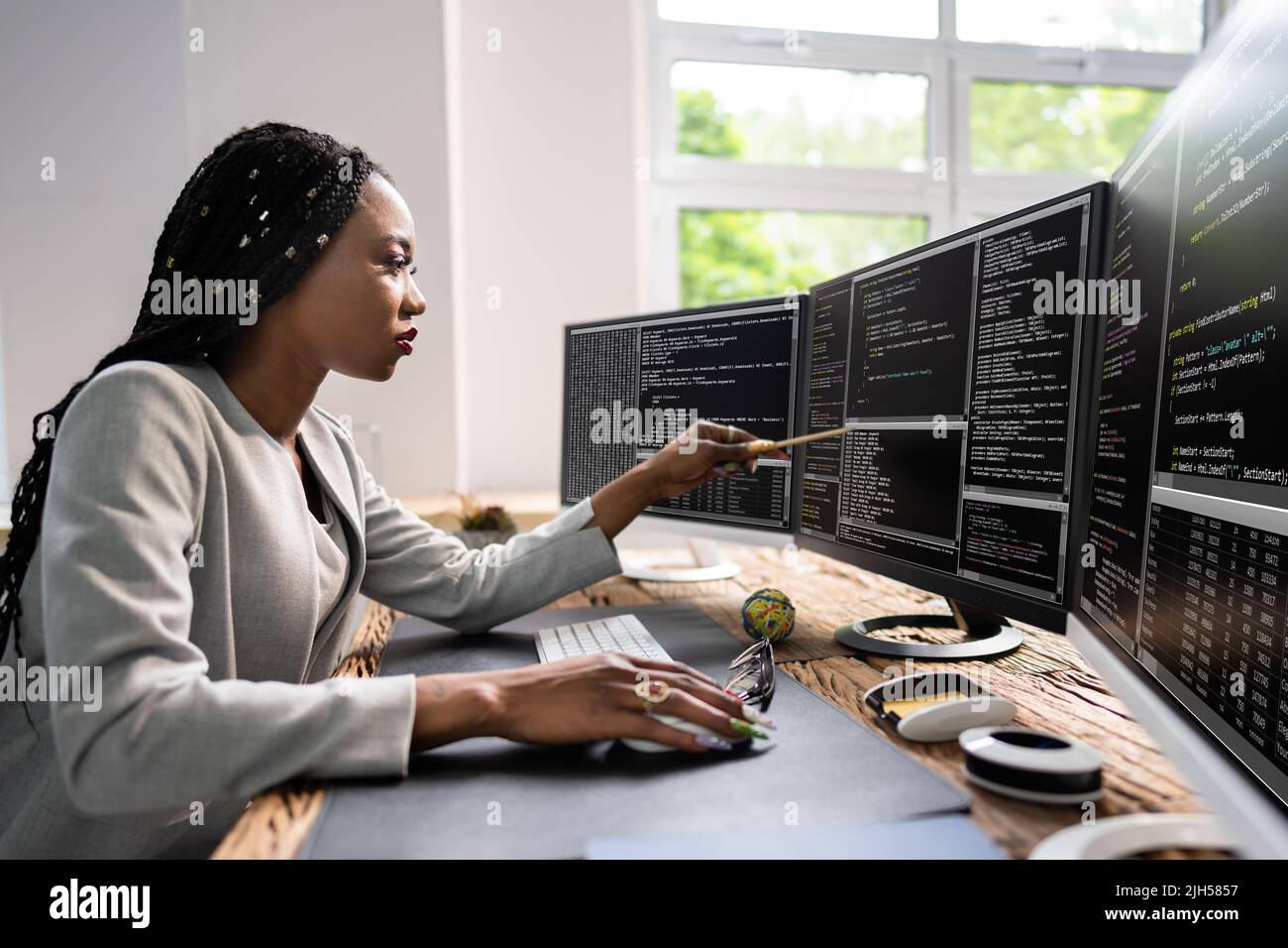 African American Coder Using Computer At Desk. Web Developer Stock Photo - Alamy