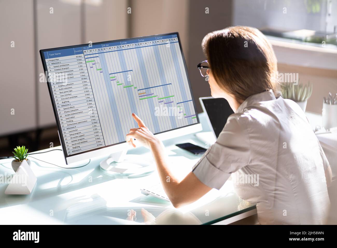 Online Time Sheet And Scheduling Report On Computer Stock Photo - Alamy