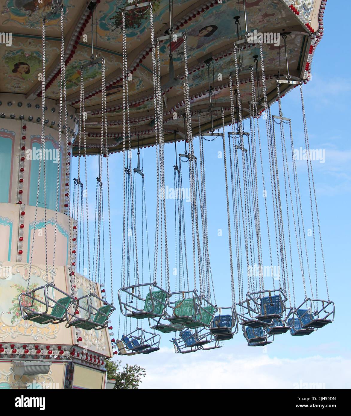 The Hanging Swing Seats of a Fun Fair Ride Stock Photo - Alamy