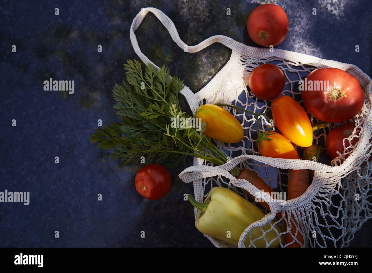 Harvest vegetables - tomatoes, drill pepper, carrots in eco shopping ...