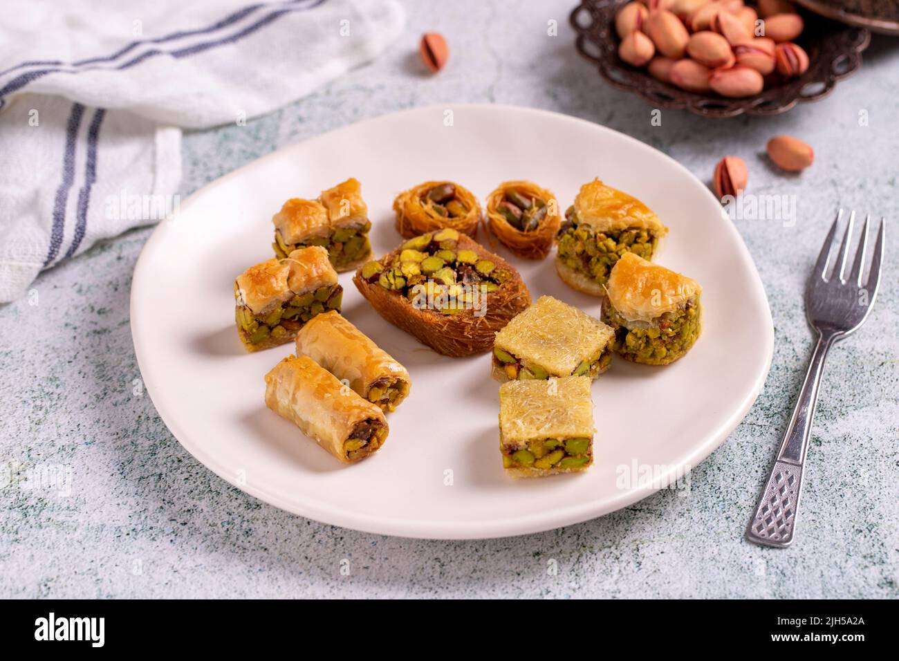 Mix pistachio baklava. Assortment of pistachio baklava on a stone ...