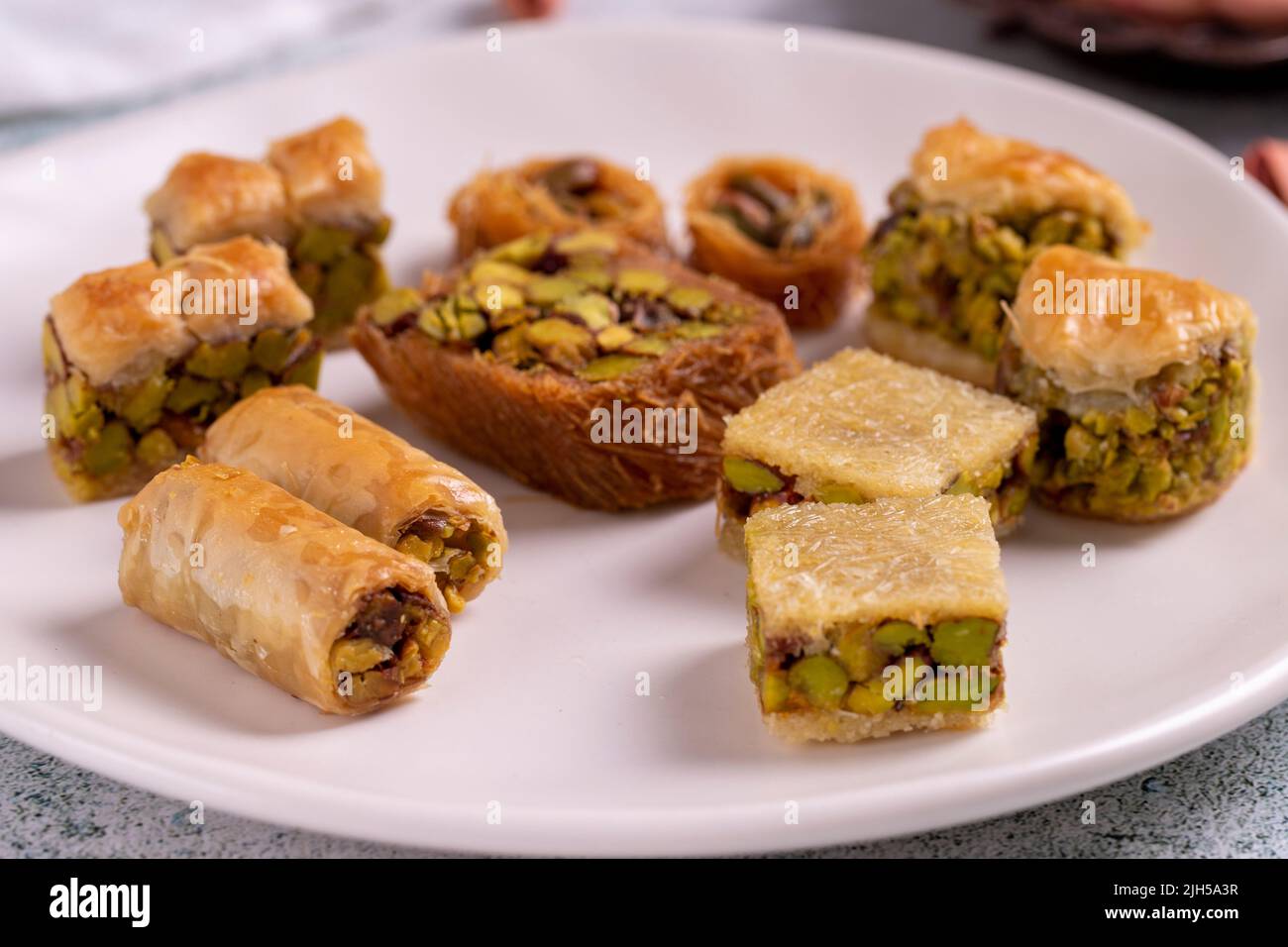 Mix pistachio baklava. Assortment of pistachio baklava on a stone ...
