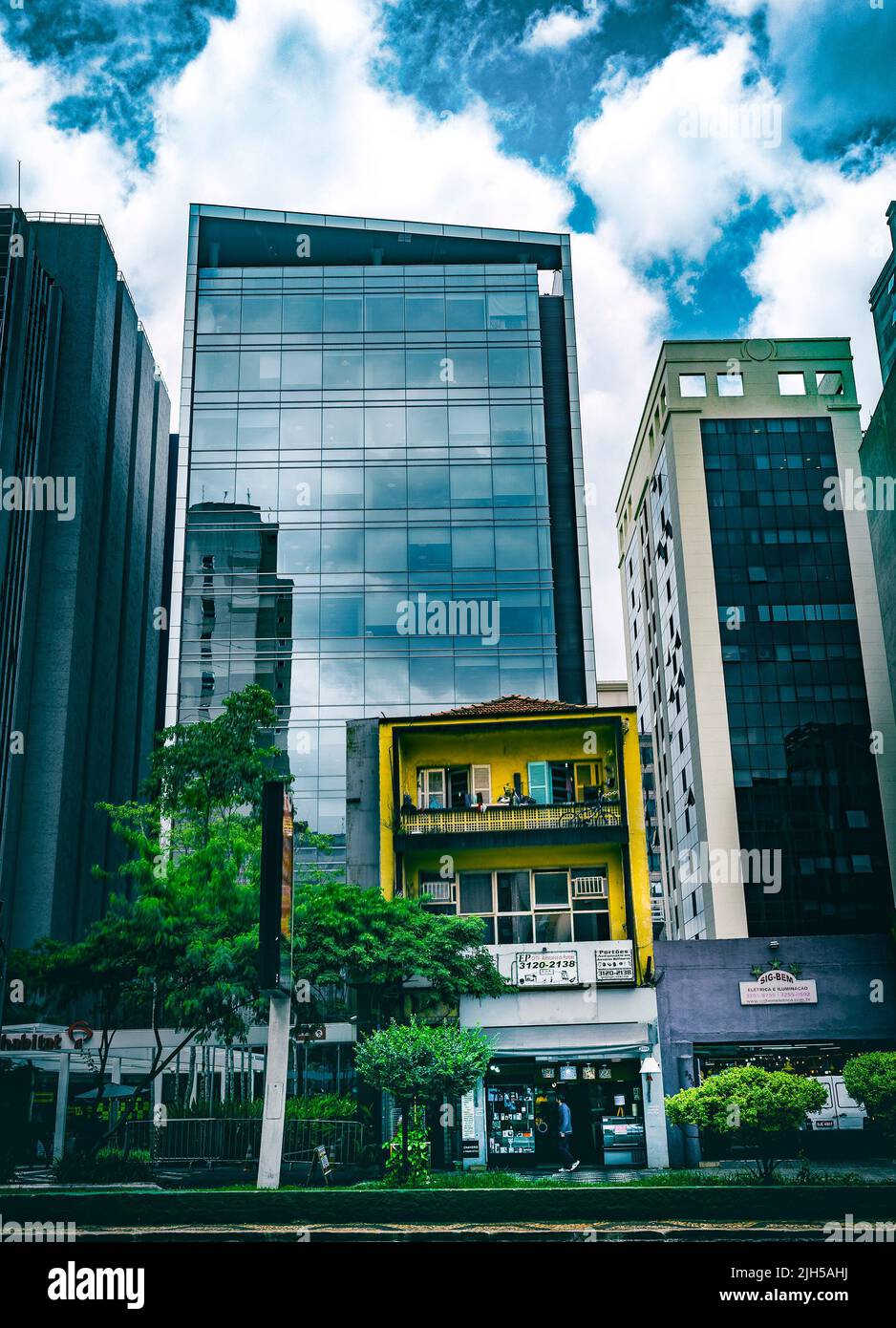A new financial building and an old yellow building together; nice ...
