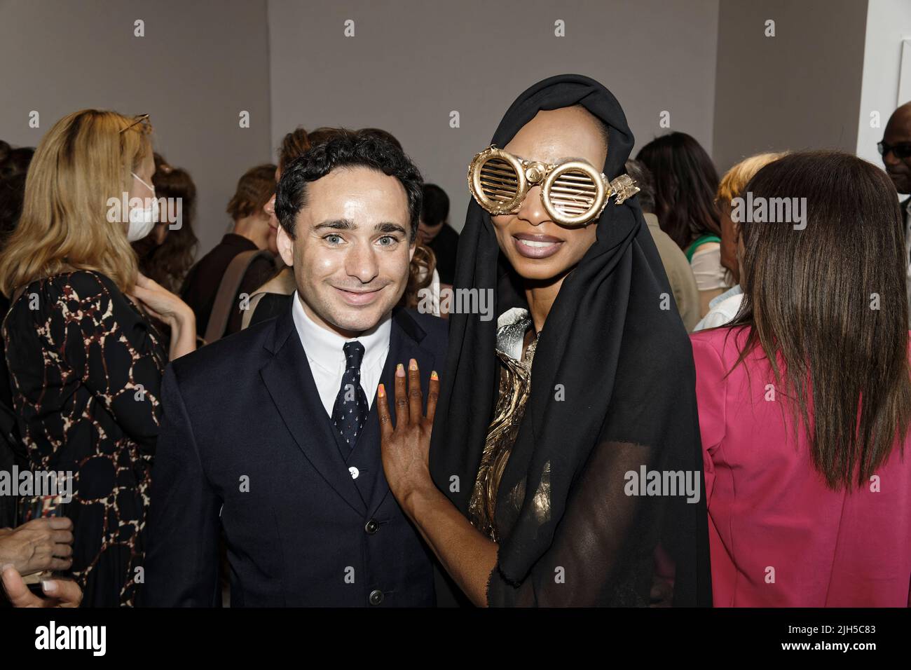 Paris, France. 6th July, 2022. A guest and a model dressed by Dem ...