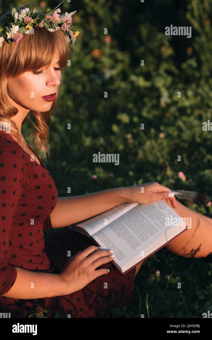 Beautiful blonde with book profile, copy space Stock Photo - Alamy