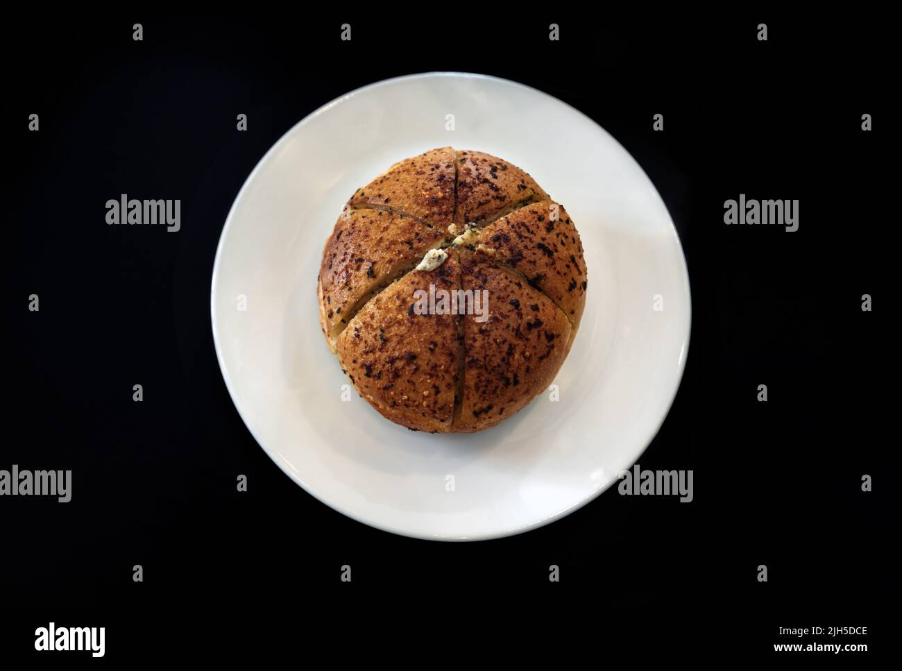 Homemade Truffle Cream Cheese Bun on white ceramic plate in black ...
