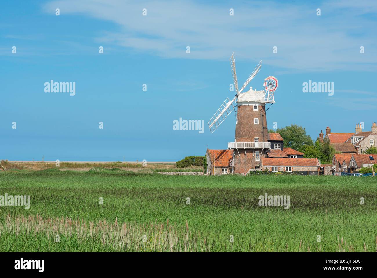 Cley Windmill Norfolk, view in summer across Cley Marshes towards the ...