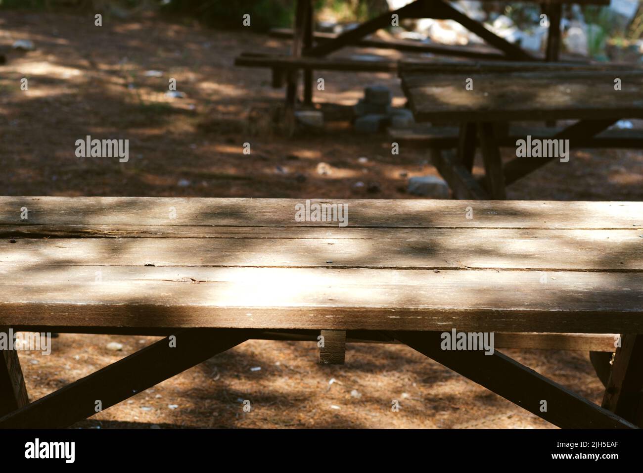 Wooden picnic table in nature Stock Photo - Alamy