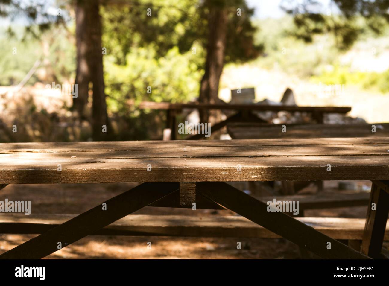 Wooden picnic table in nature Stock Photo - Alamy