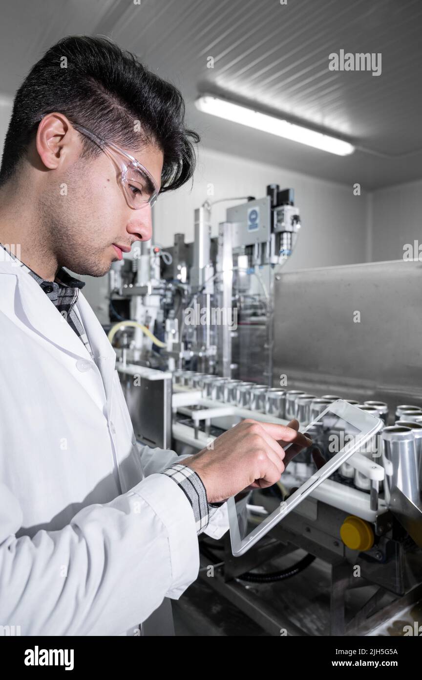 Work in modern brewery, data collection and production monitoring. High ...