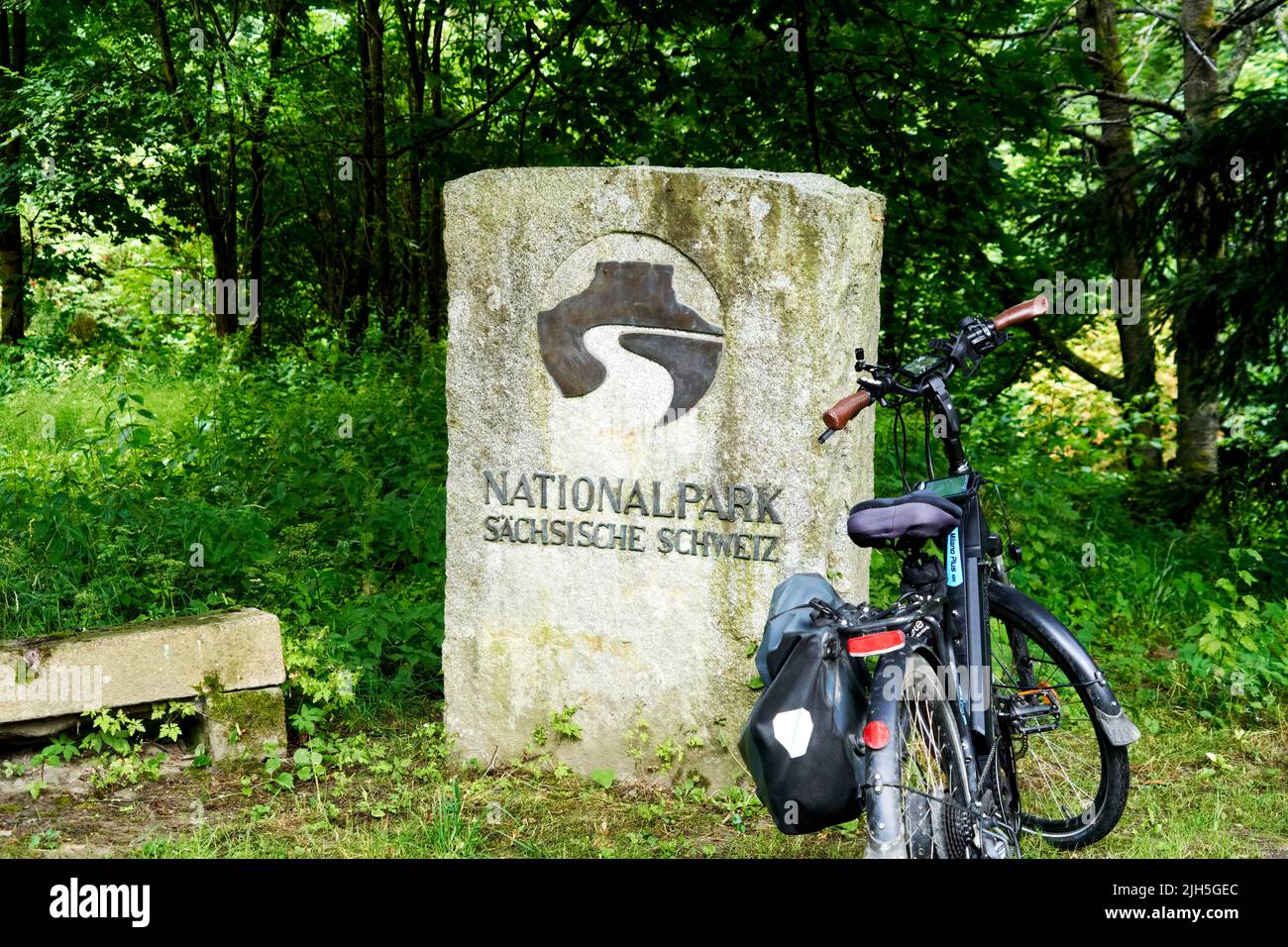 Sebnitz, Germany, July 6, 2022: Bicycle in front of a stone with ...