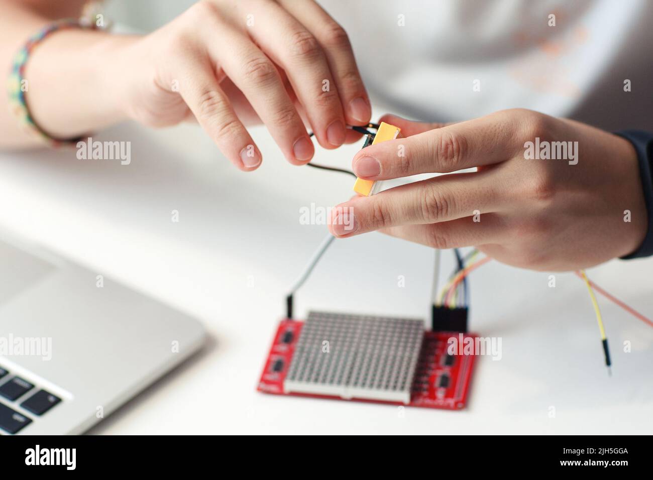 Engineer hands connecting electronic components Stock Photo - Alamy
