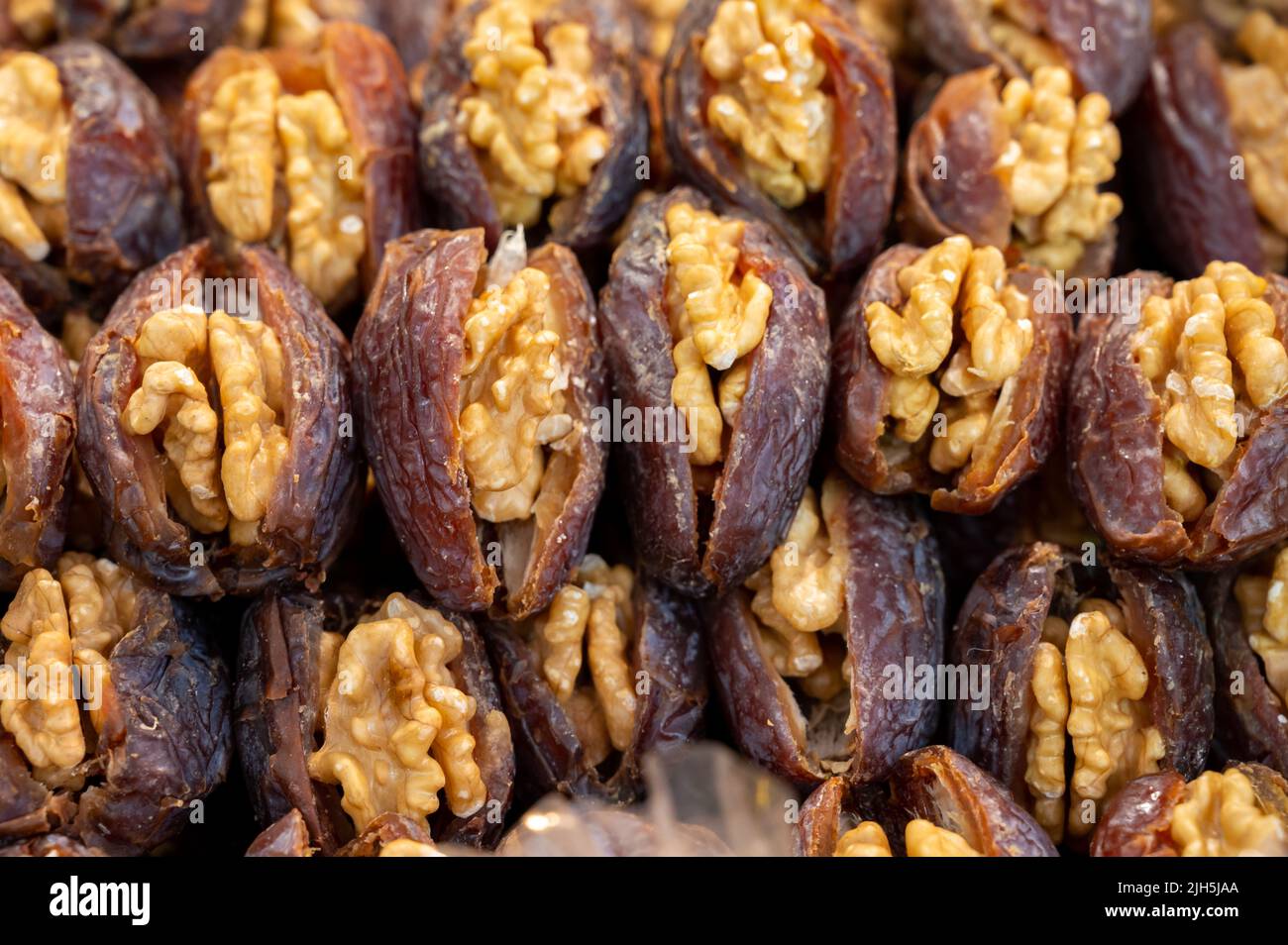 Turkish or arabic sweet dessert, ripe dried dadels with walnuts ...