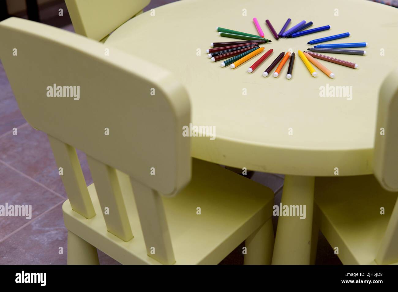 Colored markers in the shape of a circle on a children's table Stock ...