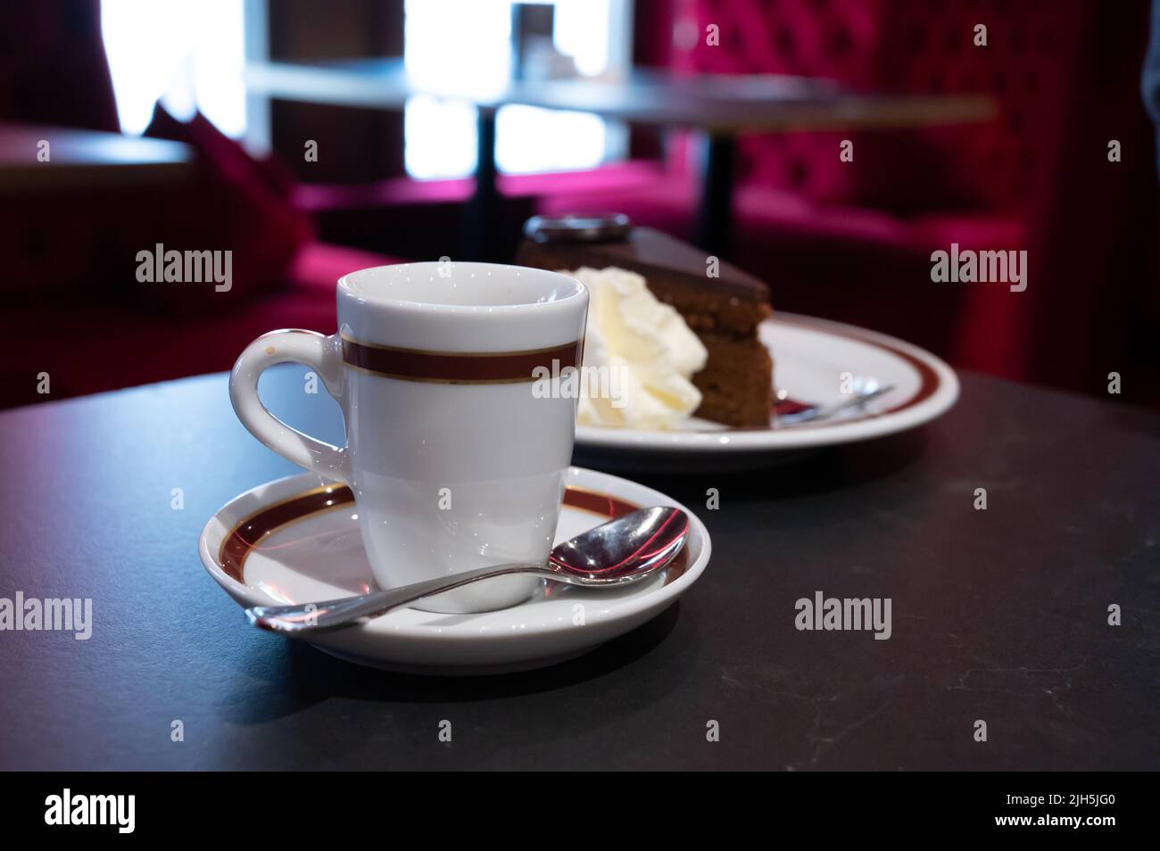 Small cup of black espresso coffee served in traditional cafe in Vienna ...