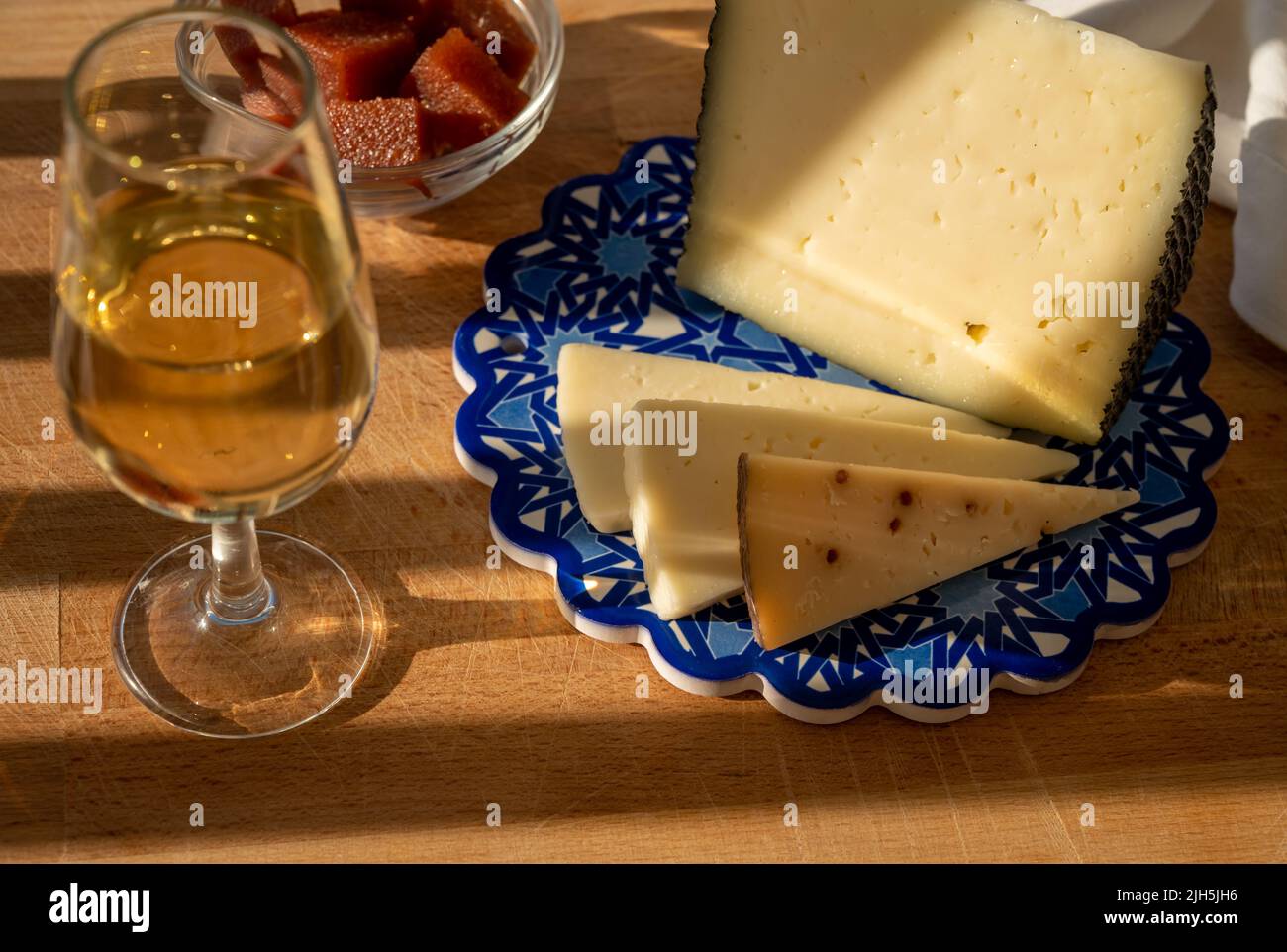 Spanish hard manchego, cow, sheep and goat cheeses served outdoor with ...